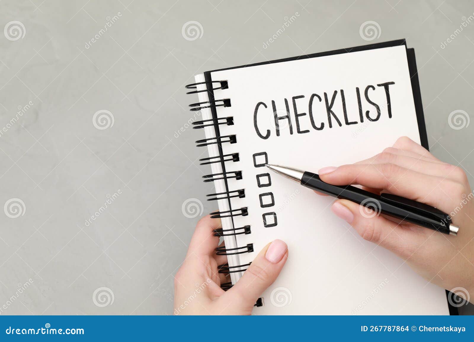 Woman Filling Checklist at Light Grey Table, Top View. Space for Text ...