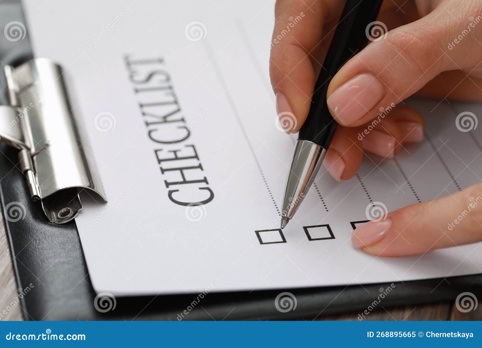 Woman Filling Checklist at Table, Closeup View Stock Image - Image of ...