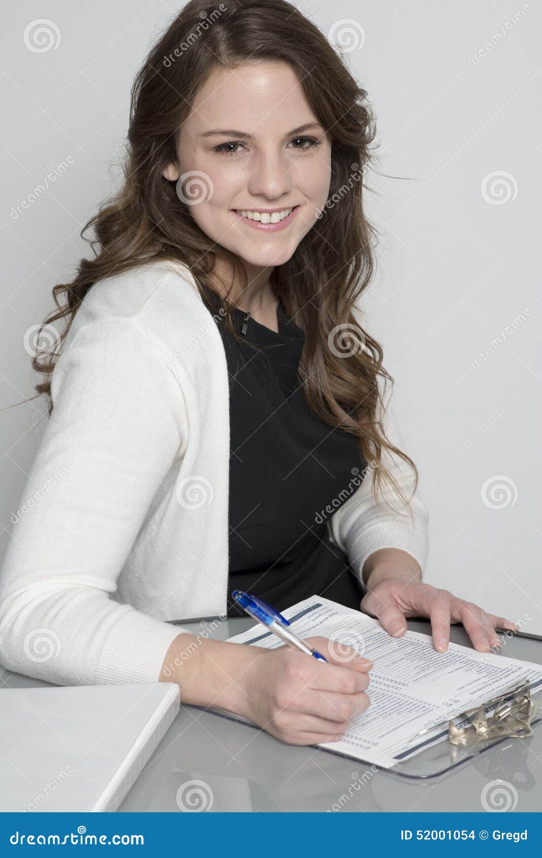 Woman filling out form stock photo. Image of businesswoman - 52001054