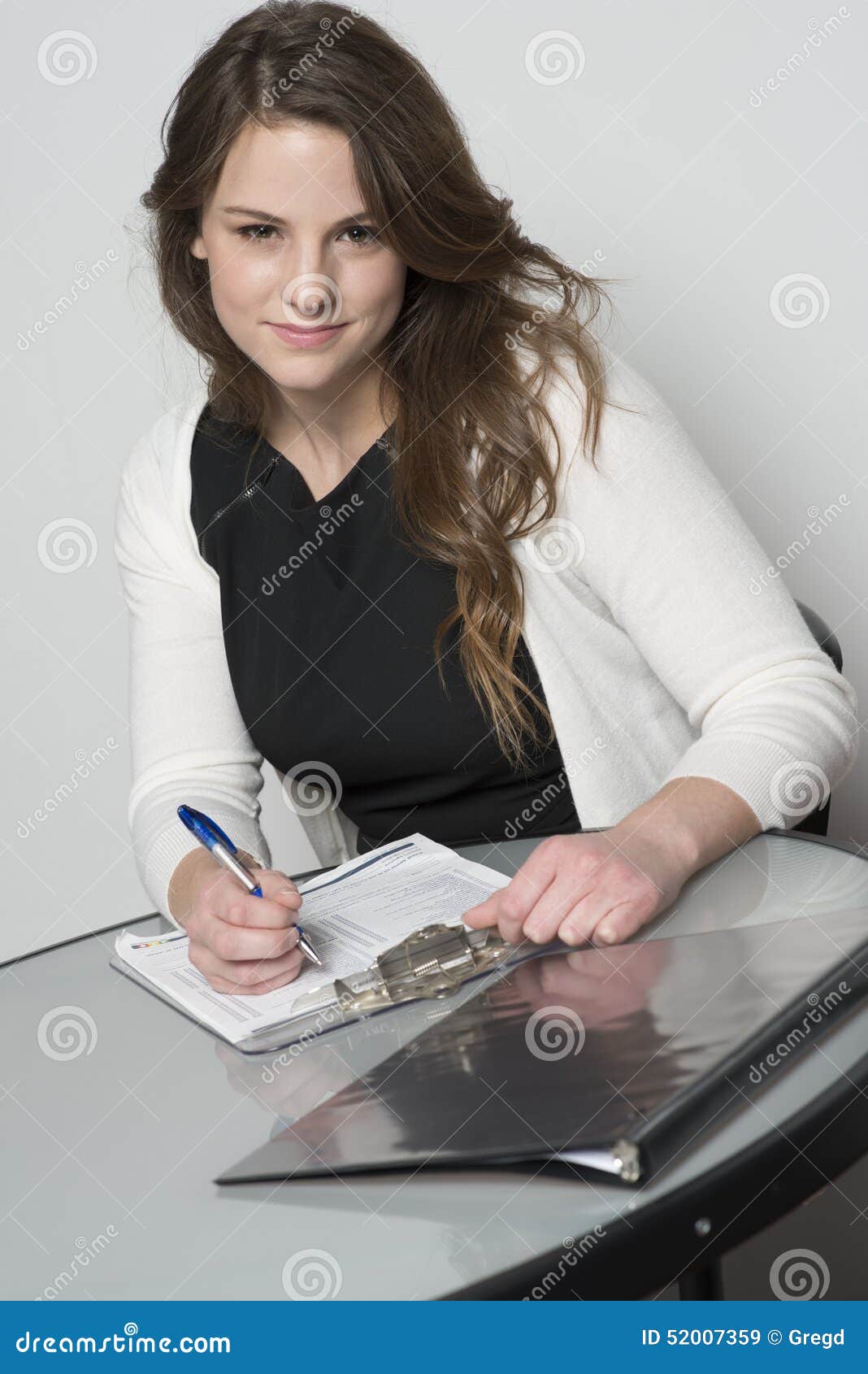 Woman filling out form stock image. Image of busy, paper - 52007359