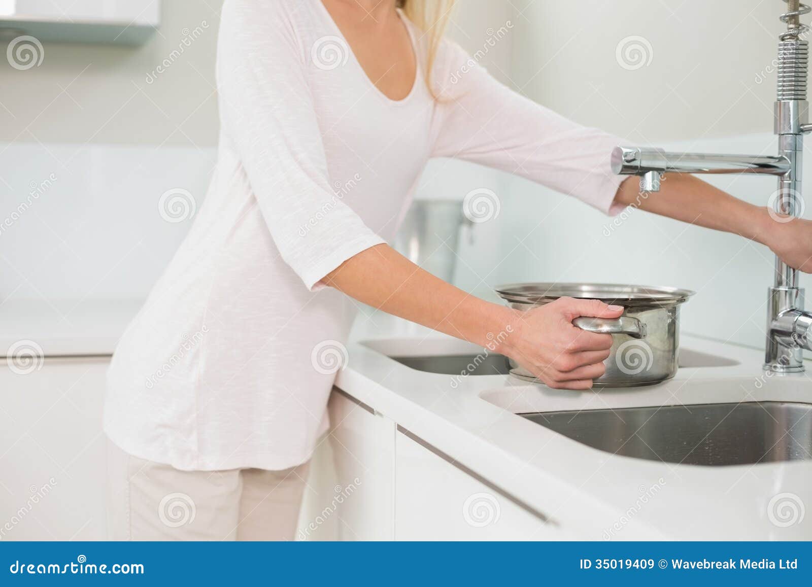 Woman Filling Pot with Water Stock Image - Image of house, years: 35019409