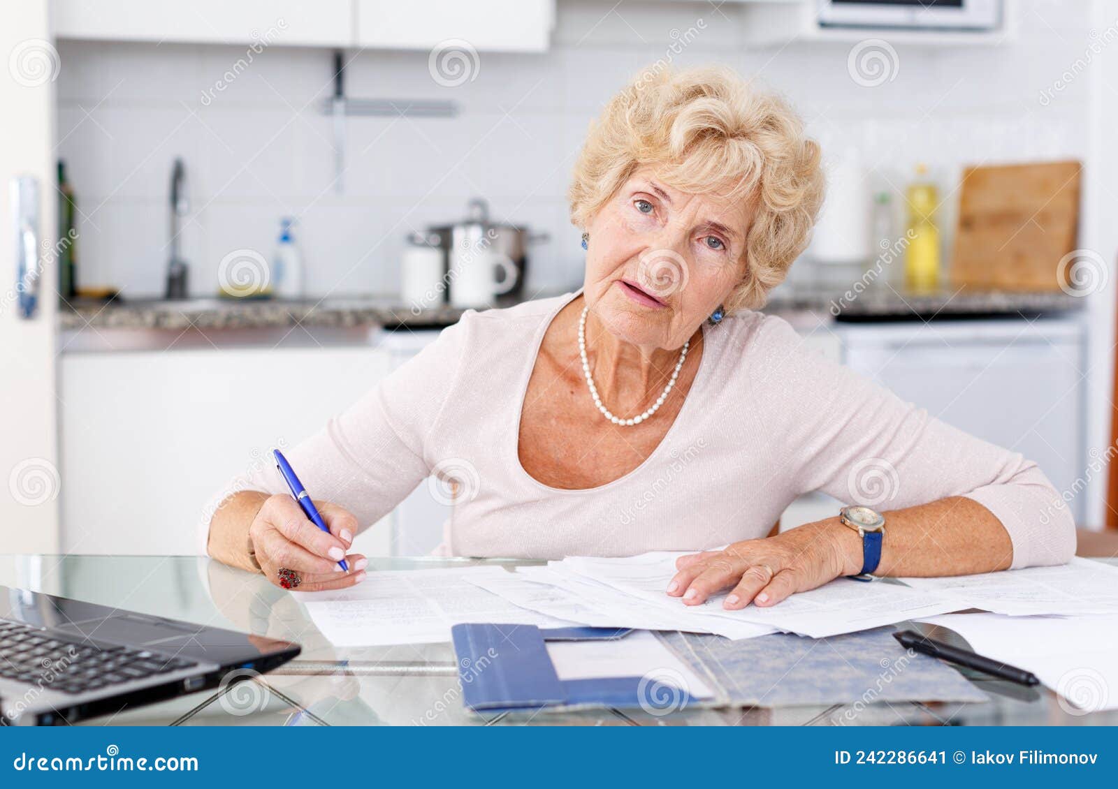 Woman filling up documents stock image. Image of papers - 242286641