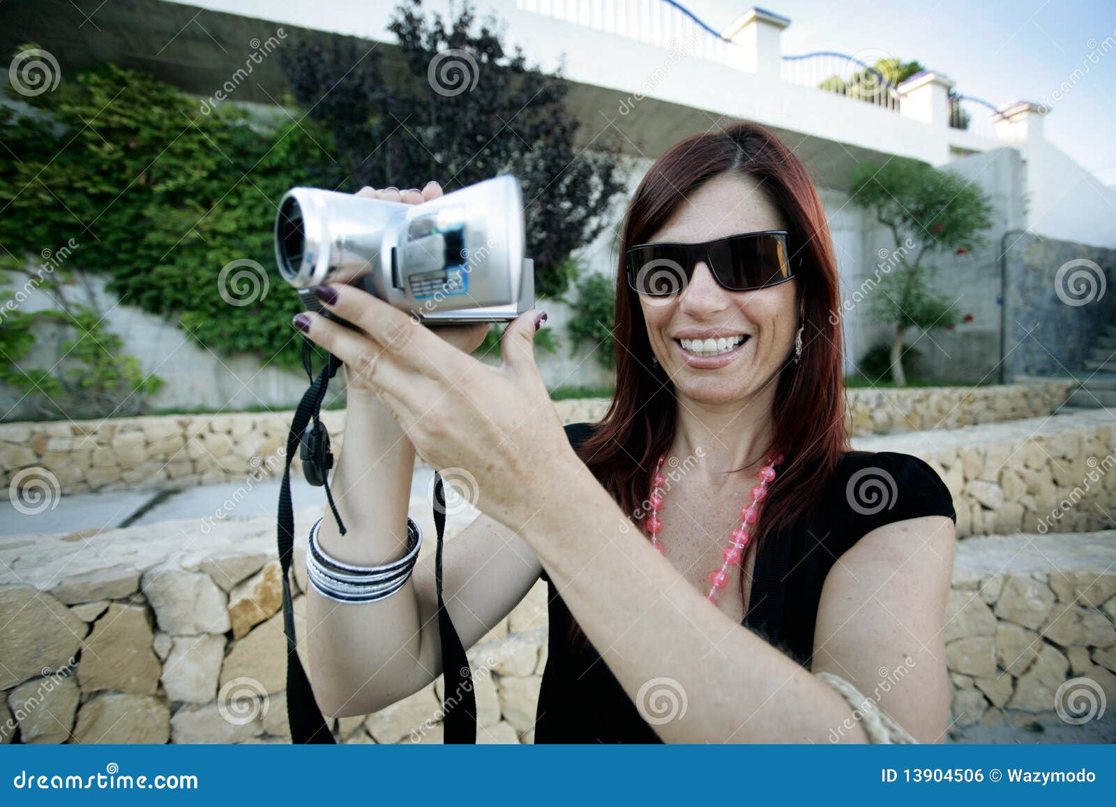Woman Filming and Using a Video Camera Stock Photo - Image of daytime ...