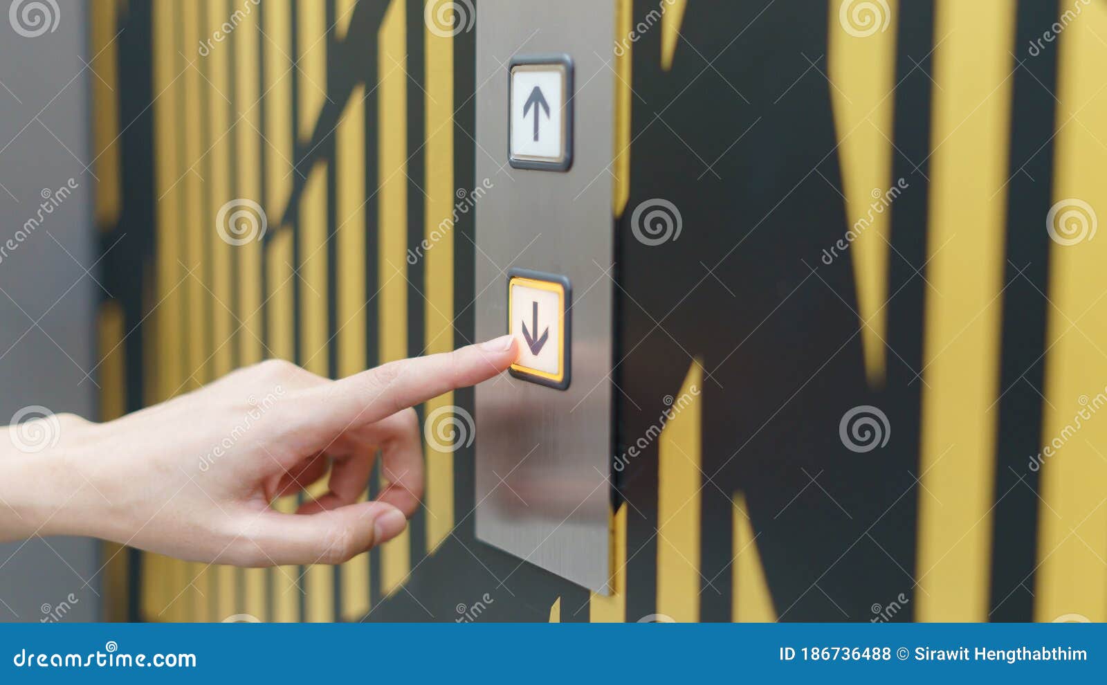 Woman Finger Pressing a Down Button of Elevator Button Inside the ...