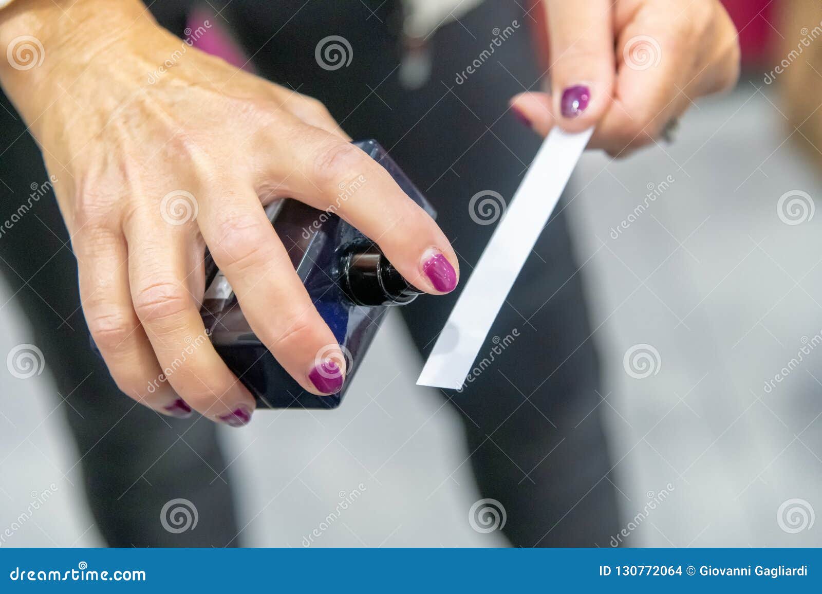 Woman Finger Spraying Perfume To Test it Stock Photo - Image of ...