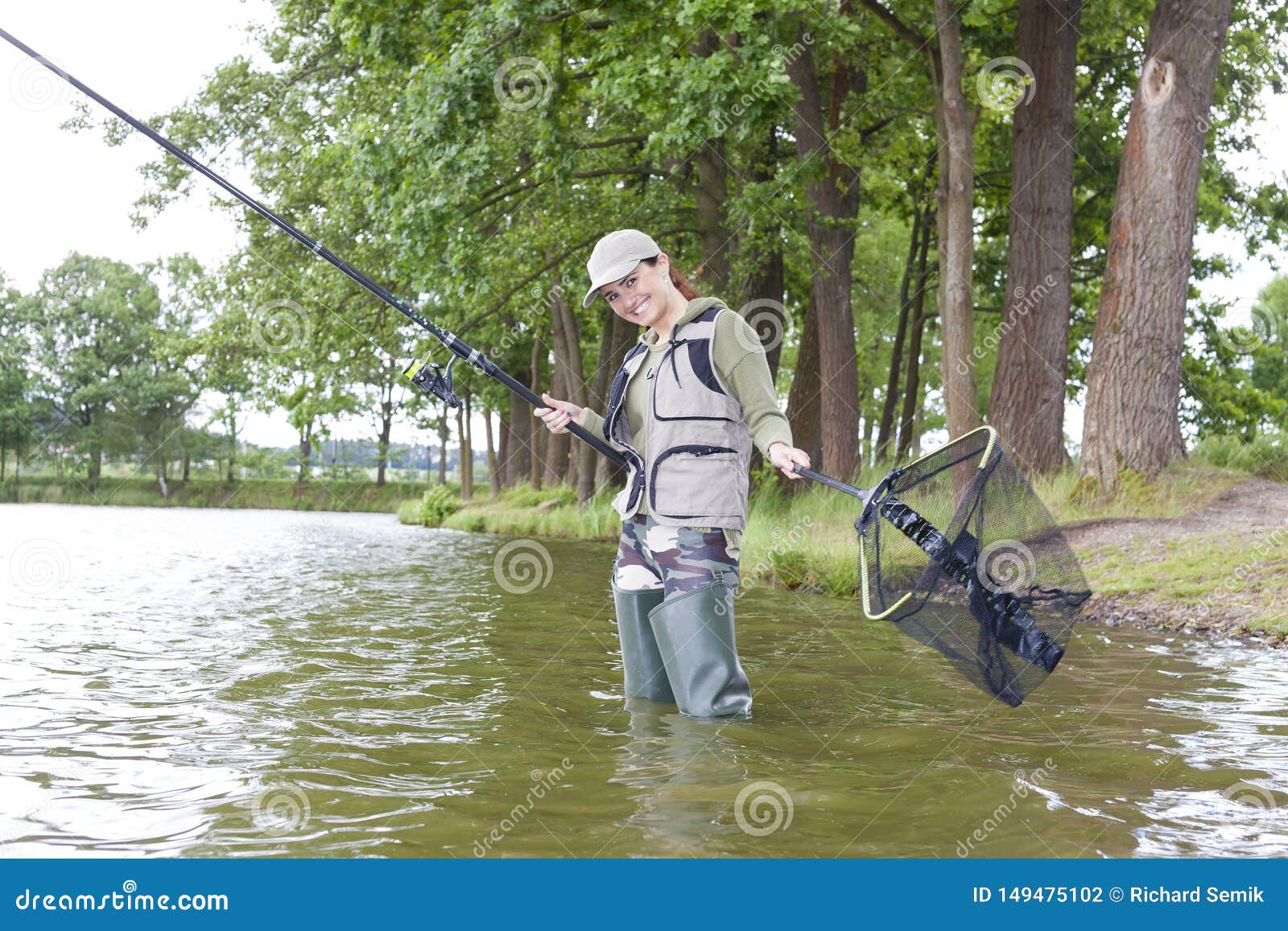 Woman Fishing in the River in Spring Stock Photo - Image of holding ...