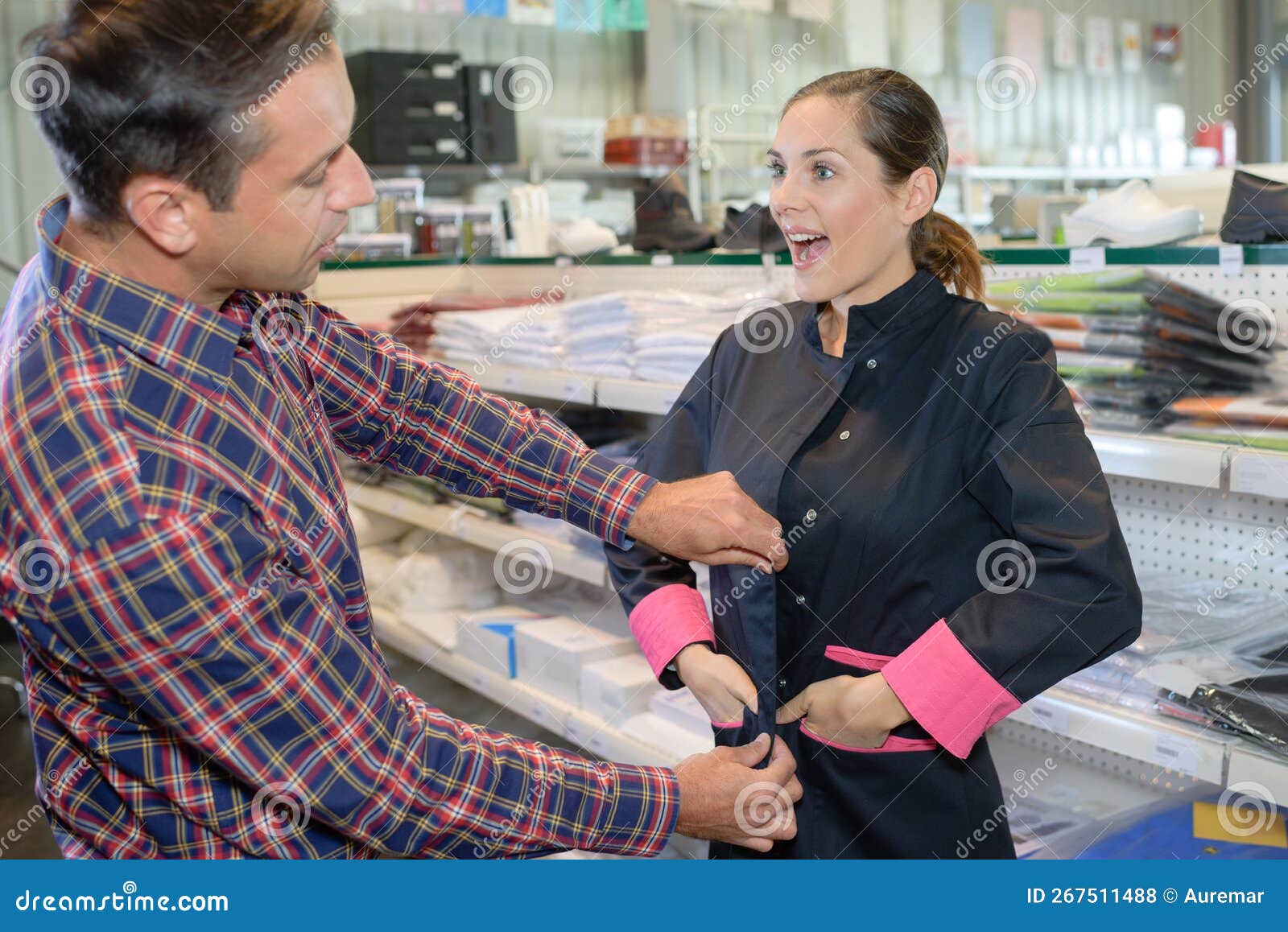 Woman fitting uniform stock photo. Image of merchandiser - 267511488