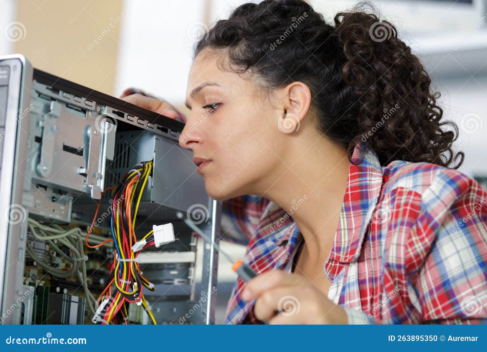 Woman Fixing Computer at Work Stock Photo - Image of sitting, woman ...