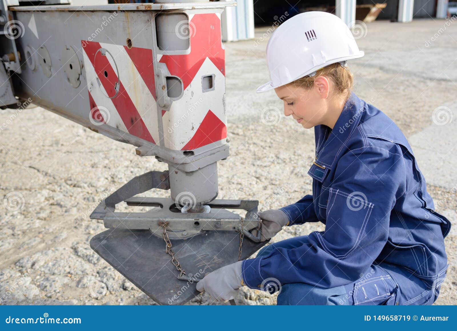 Woman Fixing Crane`s Support Leg Stock Image - Image of site ...