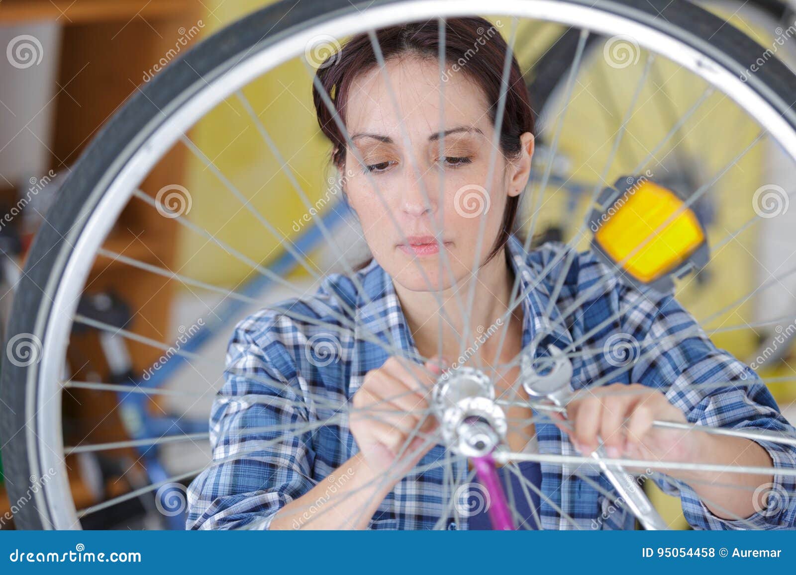 Woman Fixing Gear on Bicycle Stock Photo - Image of sport, defect: 95054458