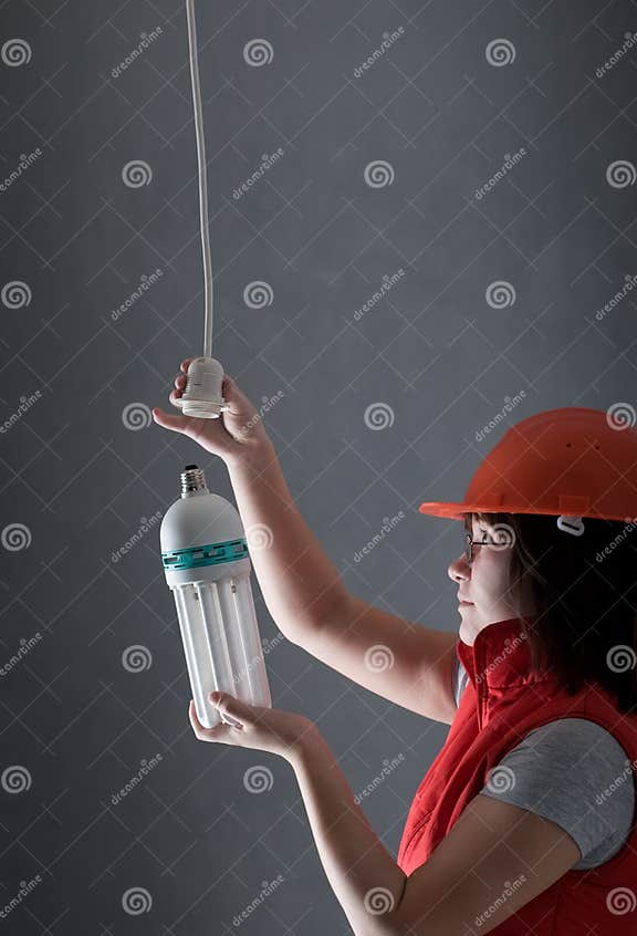 Woman fixing lamp stock photo. Image of worker, electrical - 17879988