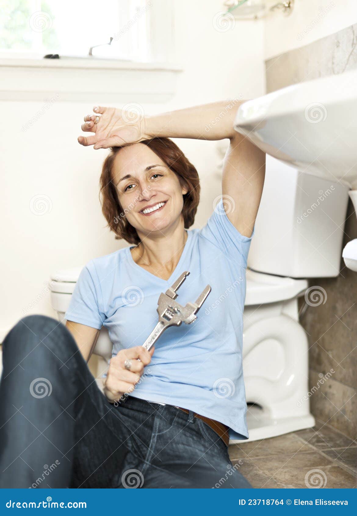 Woman fixing plumbing stock photo. Image of mature, repairing - 23718764