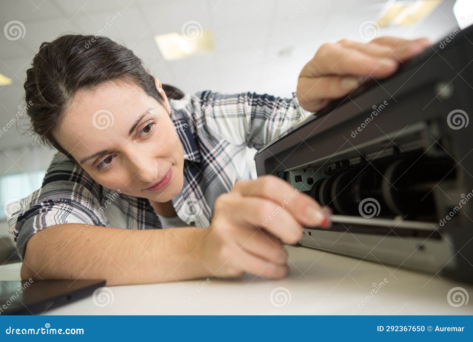 Woman fixing a printer stock photo. Image of components - 292367650