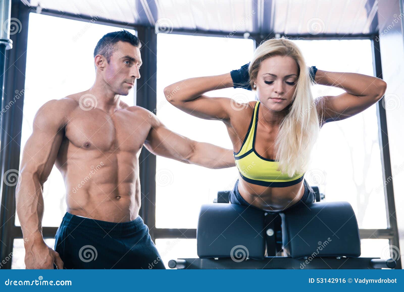 Woman Flexing Back Muscles on Bench Stock Photo - Image of body, torso ...