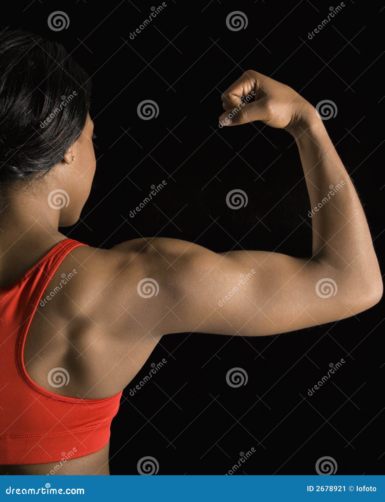 Woman In Gym Flexing Back Muscles On Cable Machine Royalty-Free Stock ...
