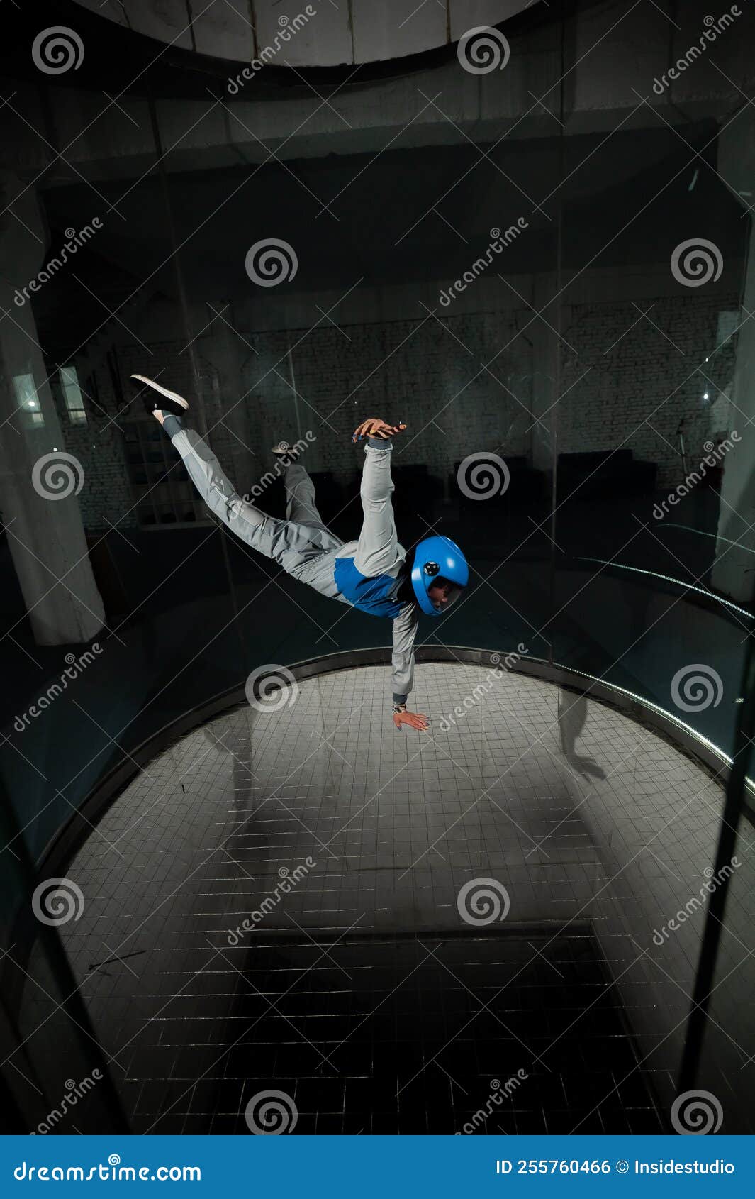A Woman Flies in a Wind Tunnel. Free Fall Simulator. Stock Photo ...