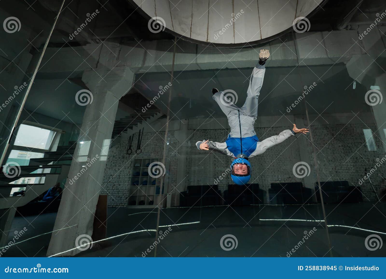 A Woman Flies in a Wind Tunnel. Free Fall Simulator. Stock Image ...