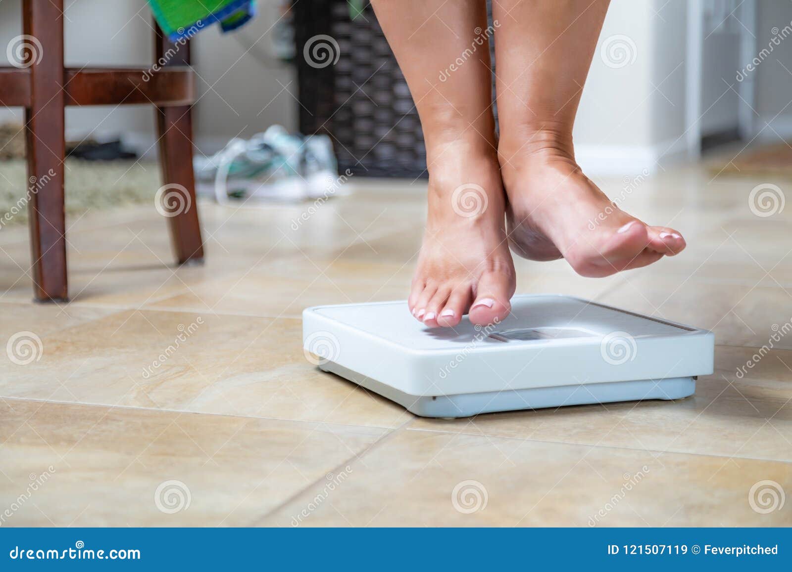 Woman Floating Slightly Above Surface of Weight Scale Stock Image ...