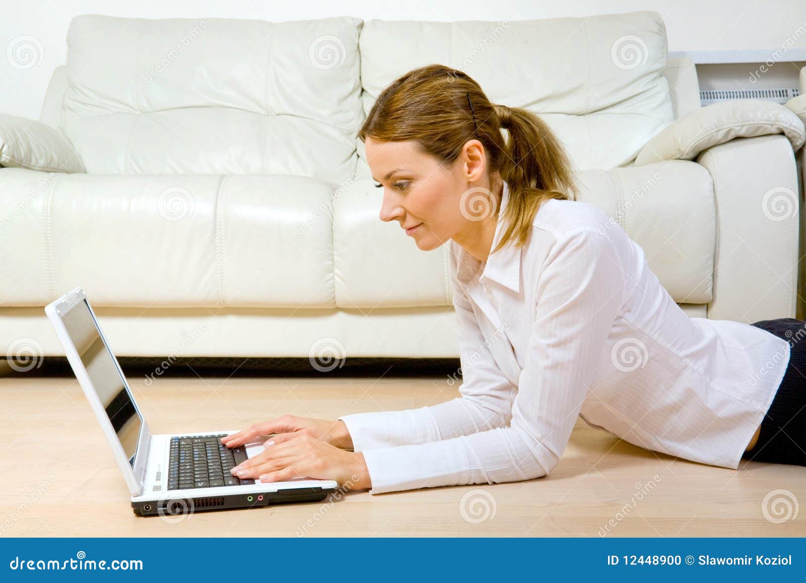 Woman on floor with laptop stock photo. Image of notebook - 12448900