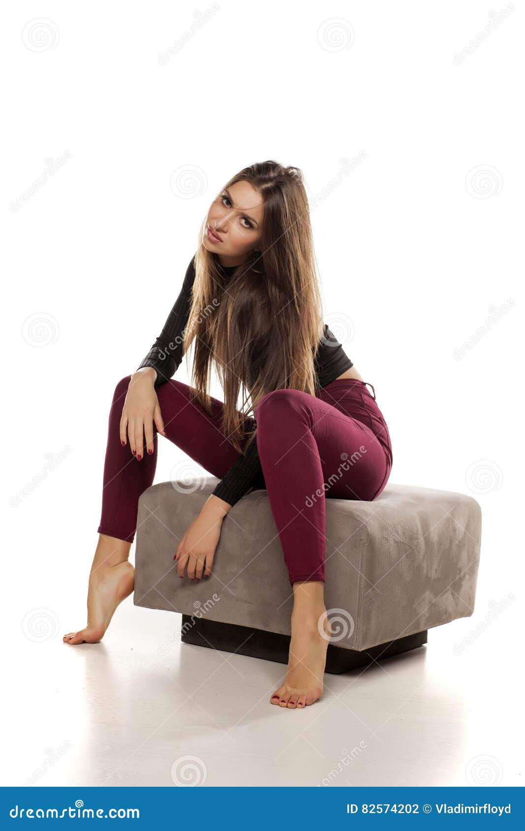 Woman on a footstool stock photo. Image of isolated, burgundy - 82574202