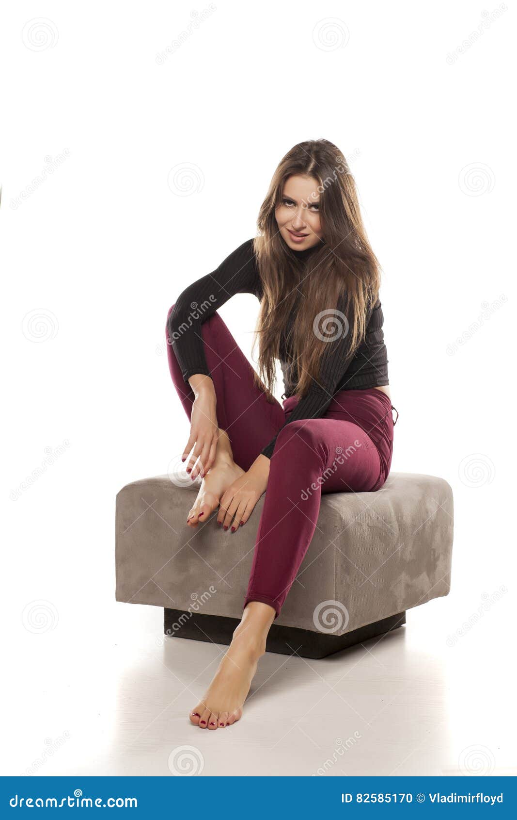 Woman on a footstool stock photo. Image of barefoot, brunette - 82585170