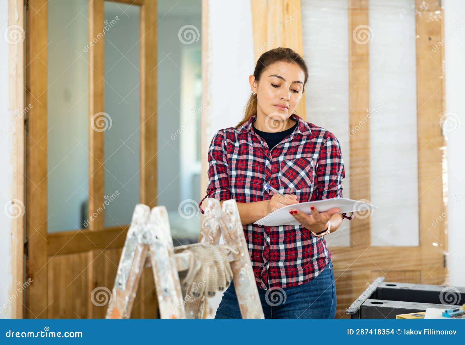 Woman Foreman Checks the Completed Construction Work on Drawing Stock ...
