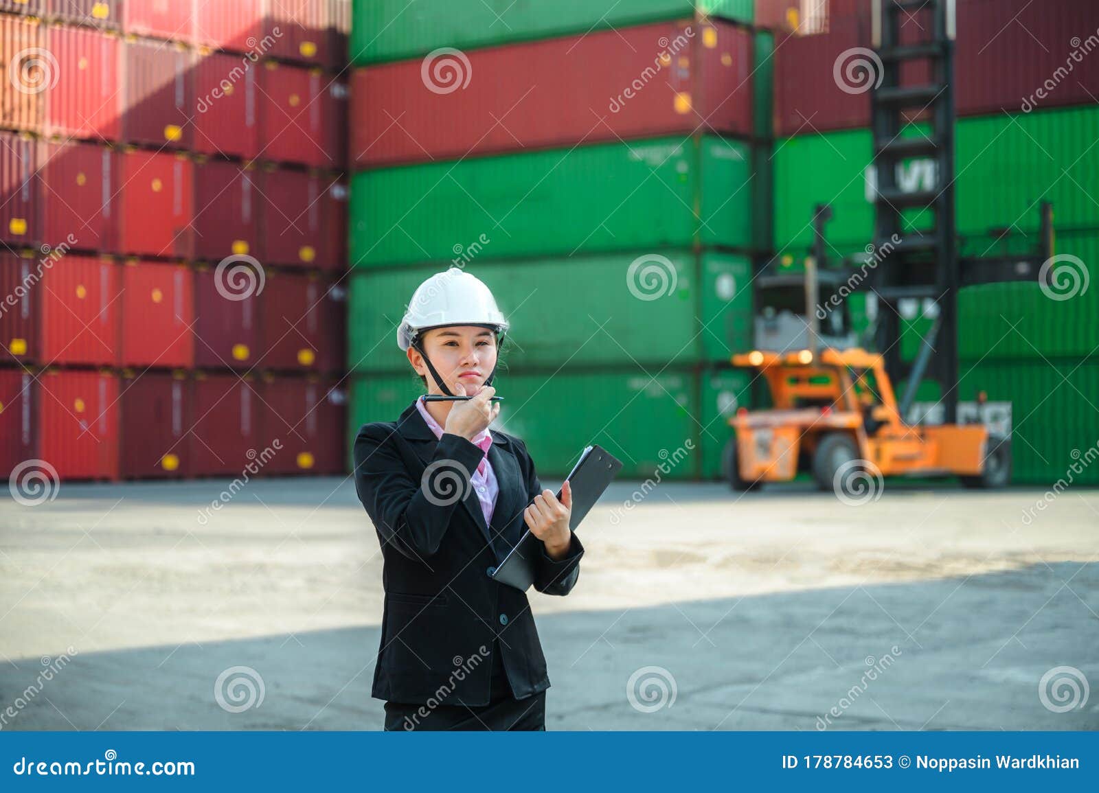 Woman Foreman Control Loading Containers Box from Cargo Freight Ship ...