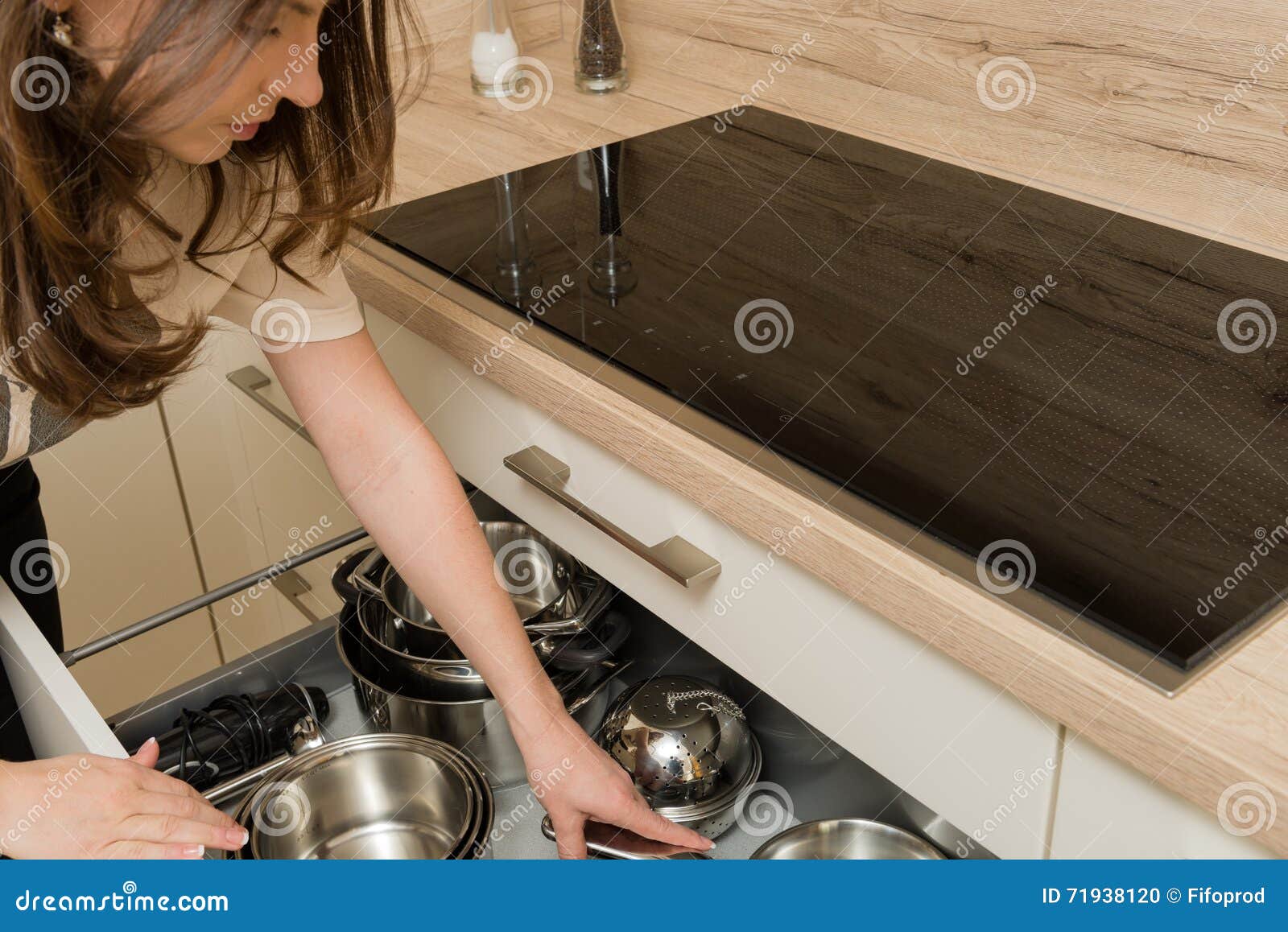 Woman in Front of Modern Cooker with Open Drawer Under the Stove Stock ...