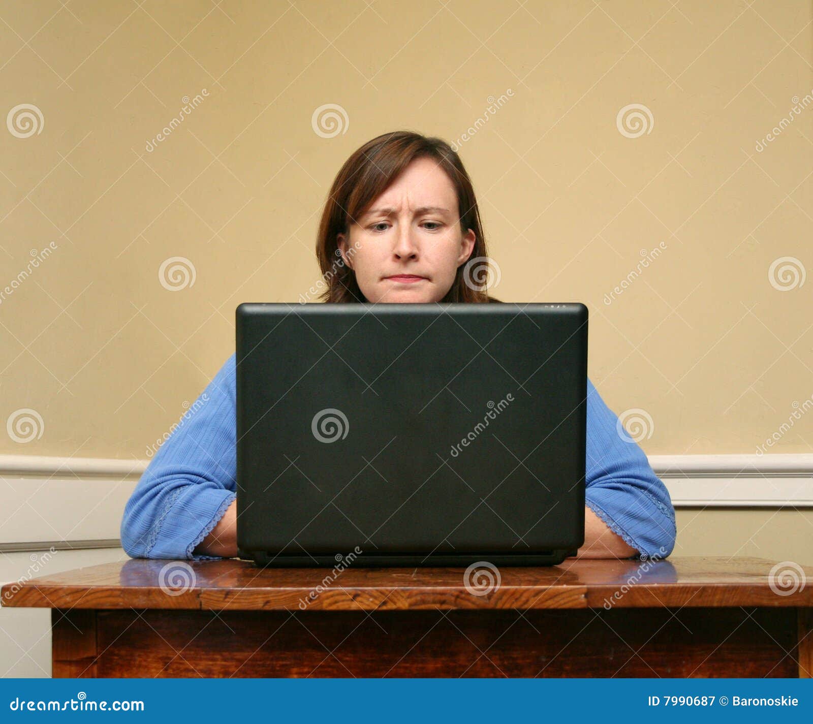 Woman Frowning at Computer stock image. Image of caucasian - 7990687