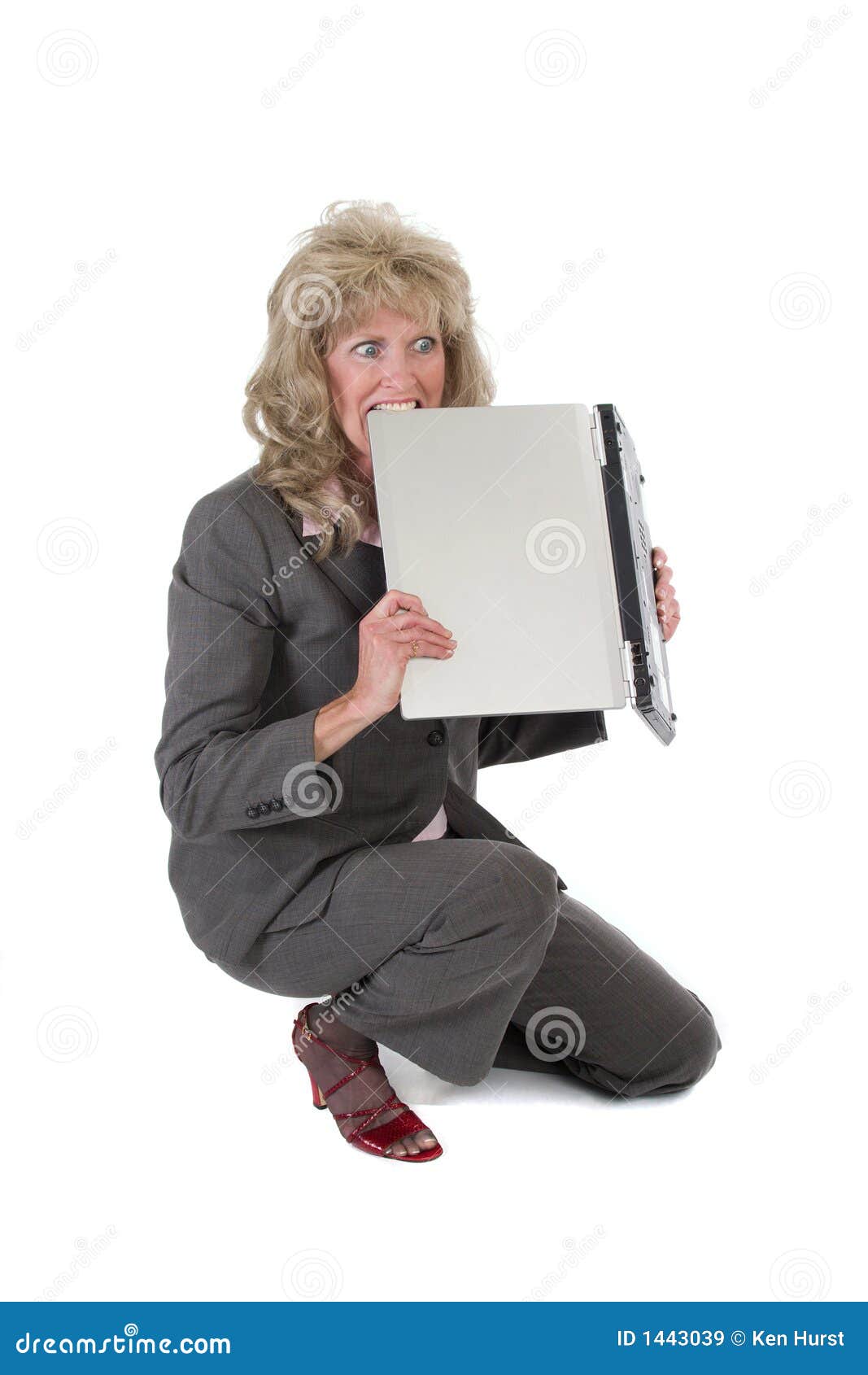 Woman Frustrated with Laptop Biting it Stock Image - Image of knees ...