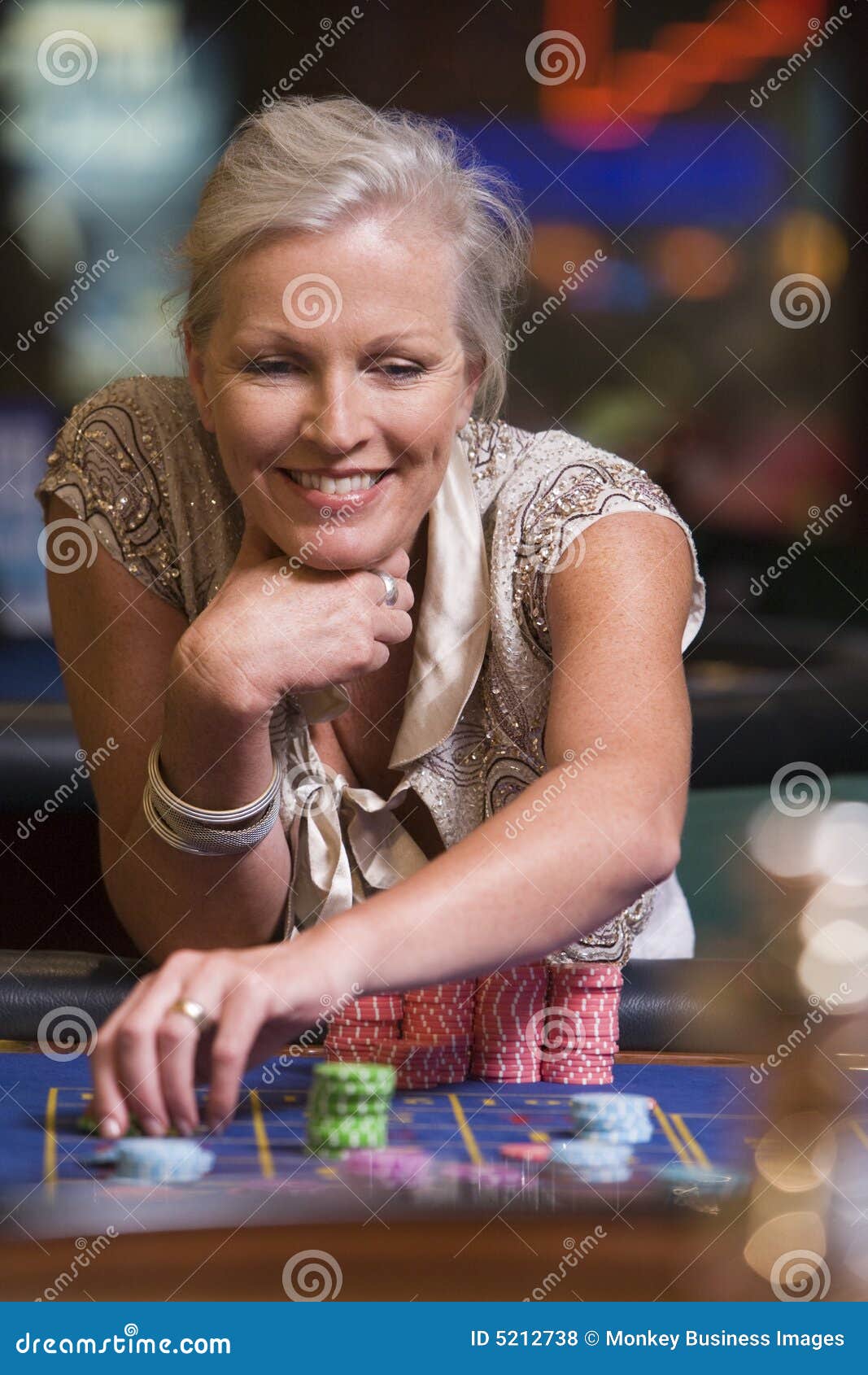 Woman Gambling at Roulette Table Stock Photo - Image of evening ...