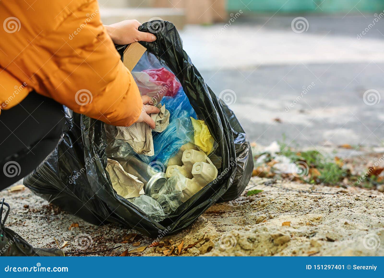 Woman Gathering Trash Outdoors Stock Image - Image of care, poly: 151297401