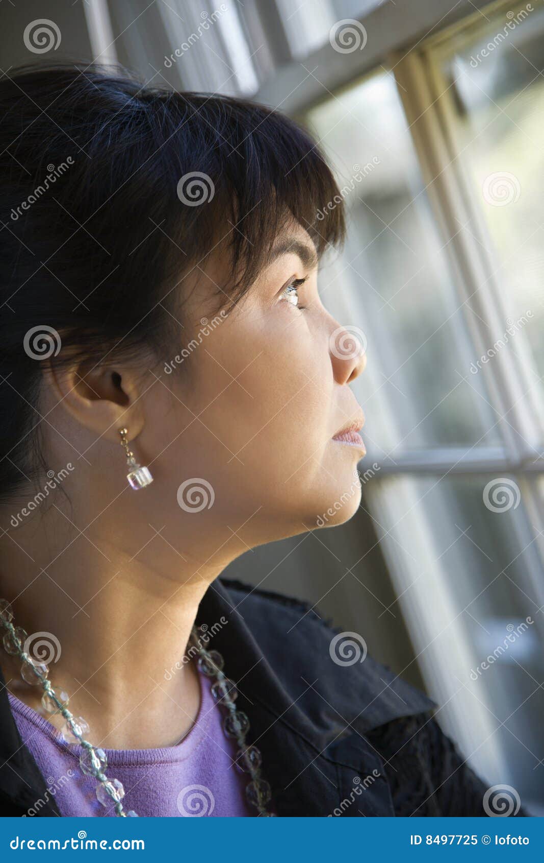 Woman gazing out window. stock image. Image of pensive - 8497725