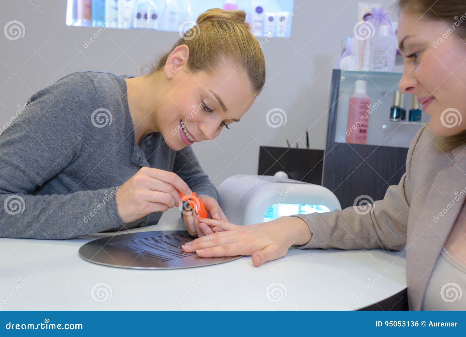 Woman Getting Nails Done at Beauty Salon Stock Photo - Image of ...