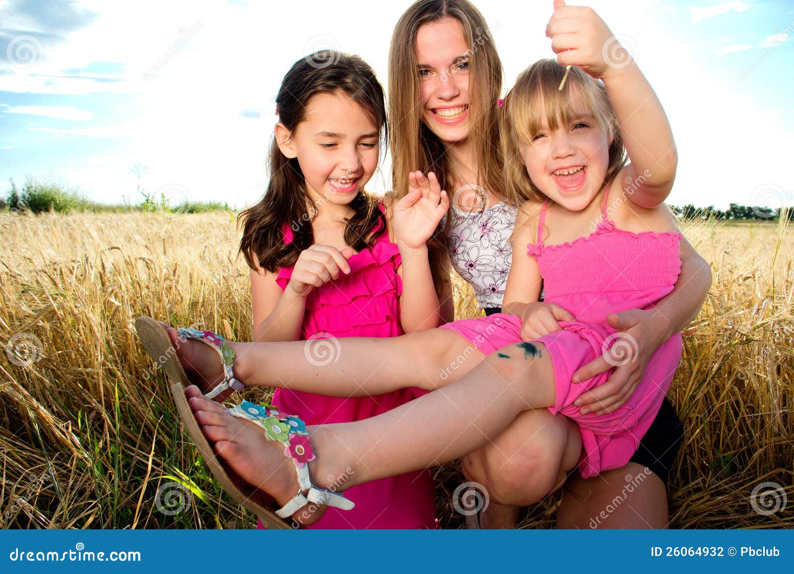 Woman and girls on field stock photo. Image of happy - 26064932