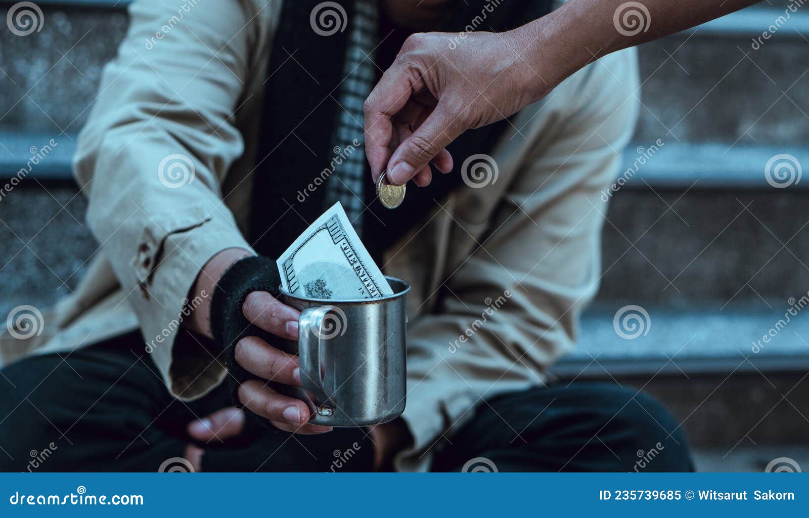 Woman Giving Money To Homeless Beggar Man Sitting In City Stock Image