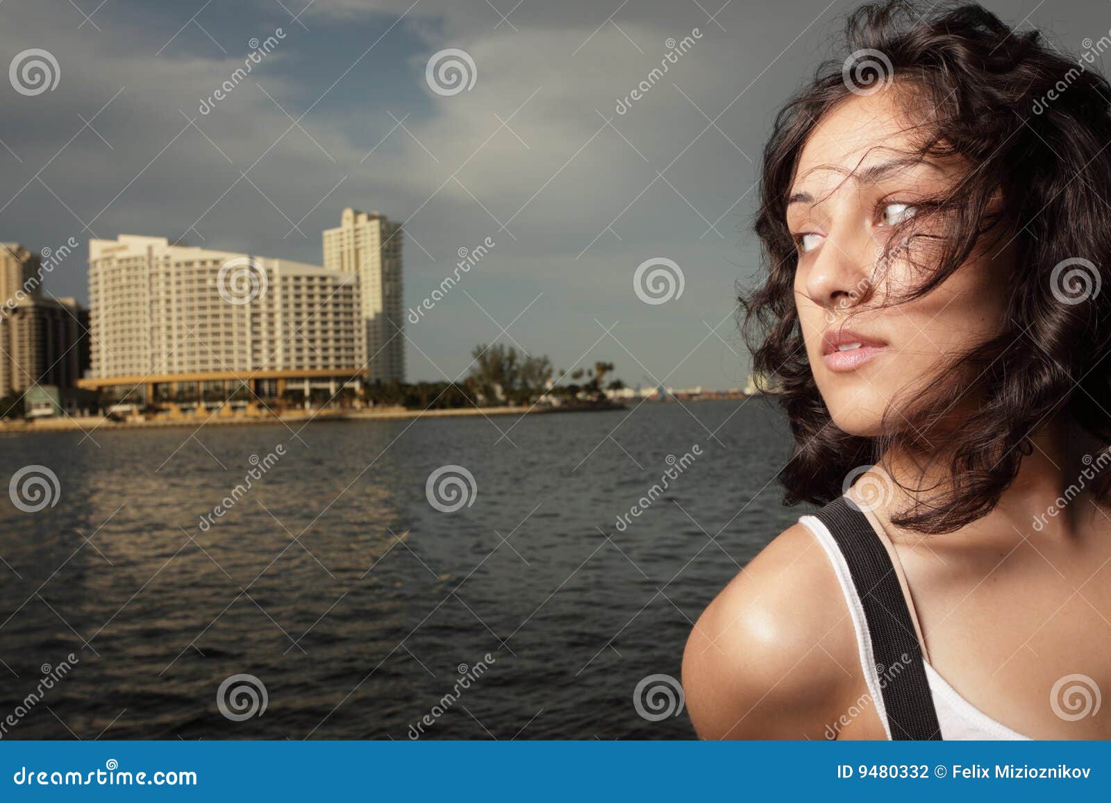 Woman glancing away stock photo. Image of wind, building - 9480332