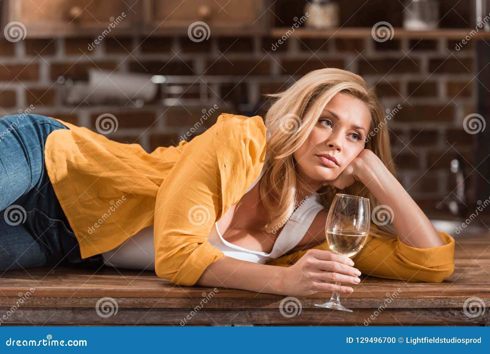 Drunk Young Woman with Glass of Wine Relaxing on Table Stock Photo ...