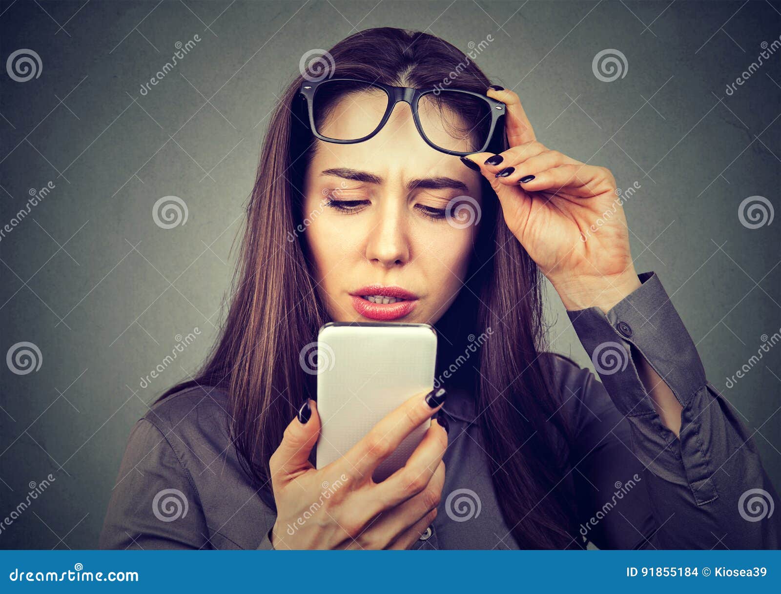 Woman with Glasses Having Trouble Seeing Cell Phone Has Vision Problems ...
