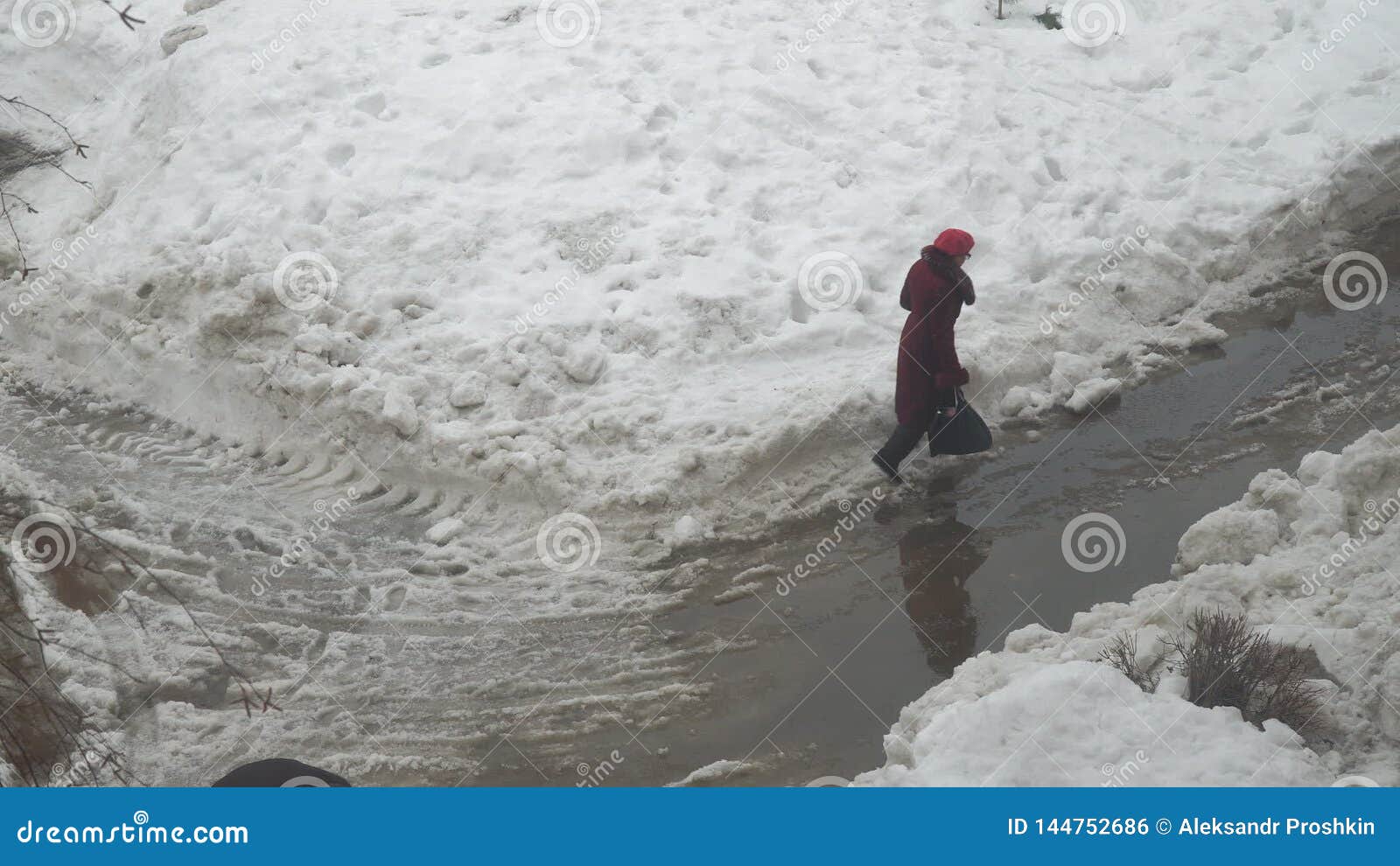 Woman Go through a Puddle and Wet Snow Stock Footage - Video of ...