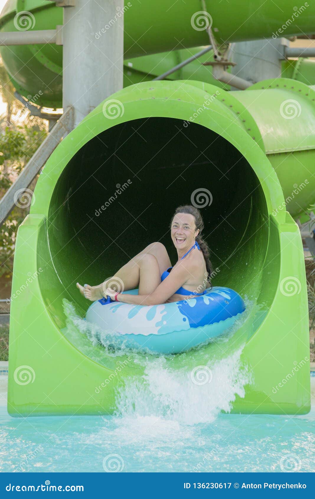Woman Going Down A Water Slide Happy Woman Going Down On The Rubber