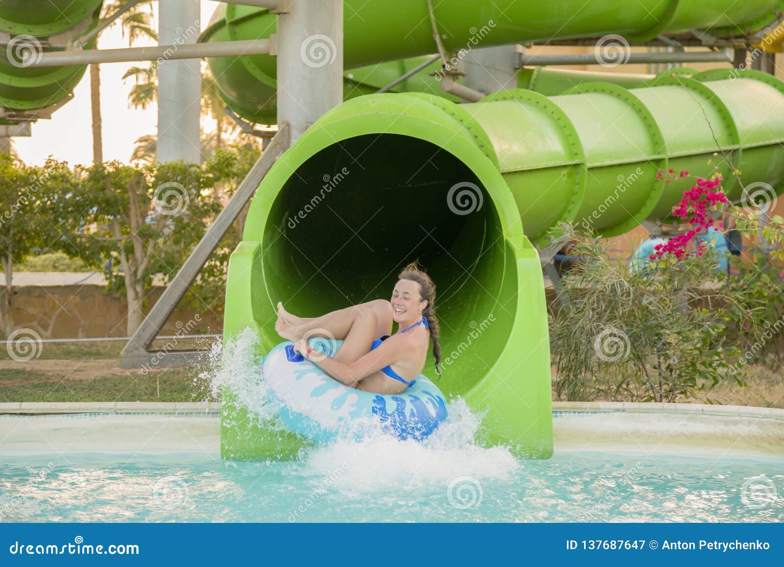 Woman Going Down A Water Slide Happy Woman Going Down On The Rubber