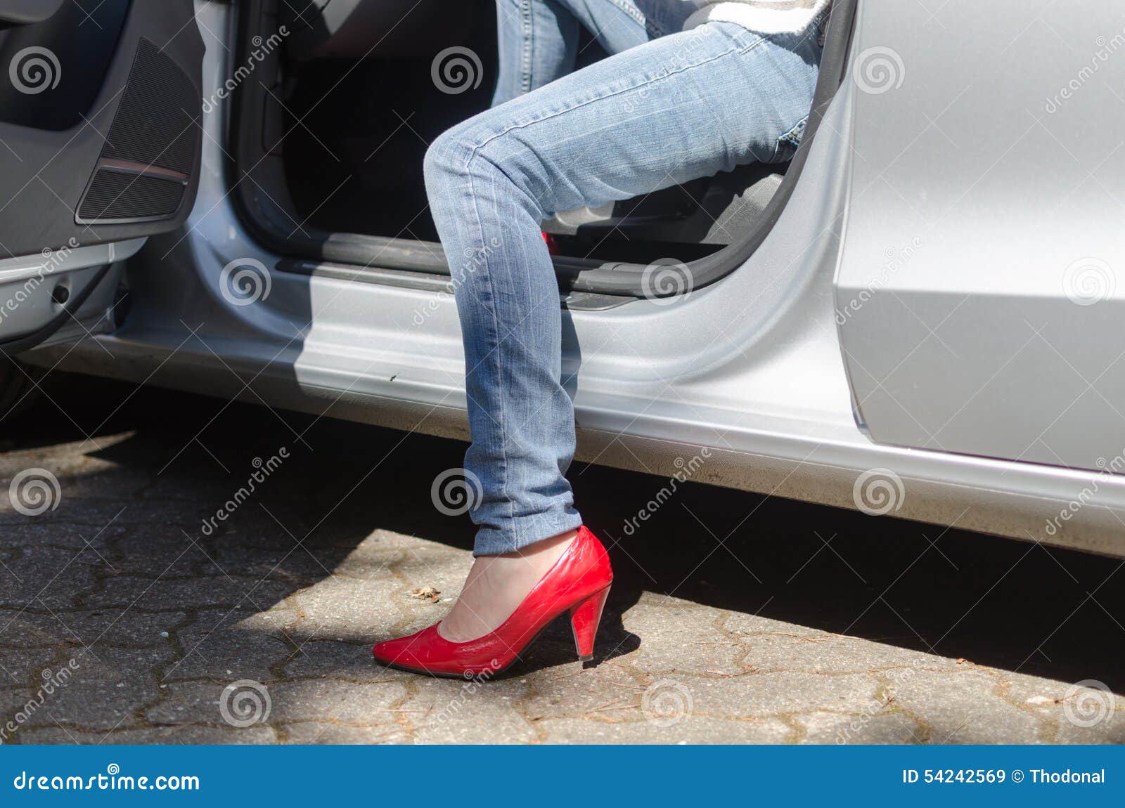 Woman going out of a car stock image. Image of shoe, driving - 54242569