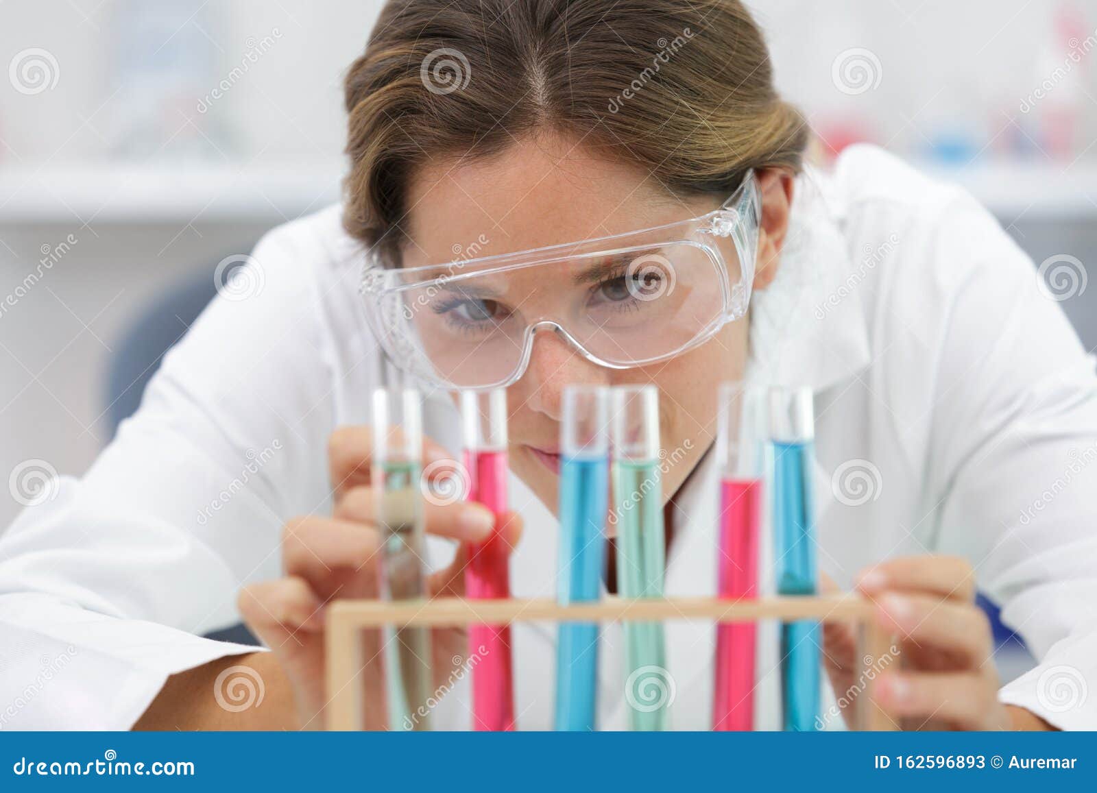 Woman with googles in lab stock image. Image of chemical - 162596893