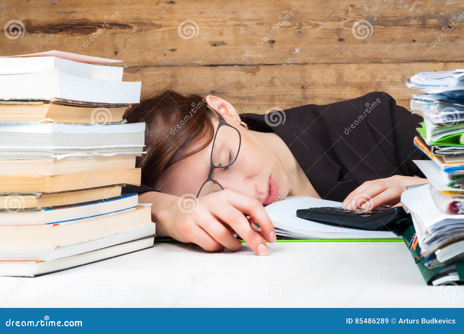 Woman Got Tired of Working and Studying Next To the Stack of Papaper ...