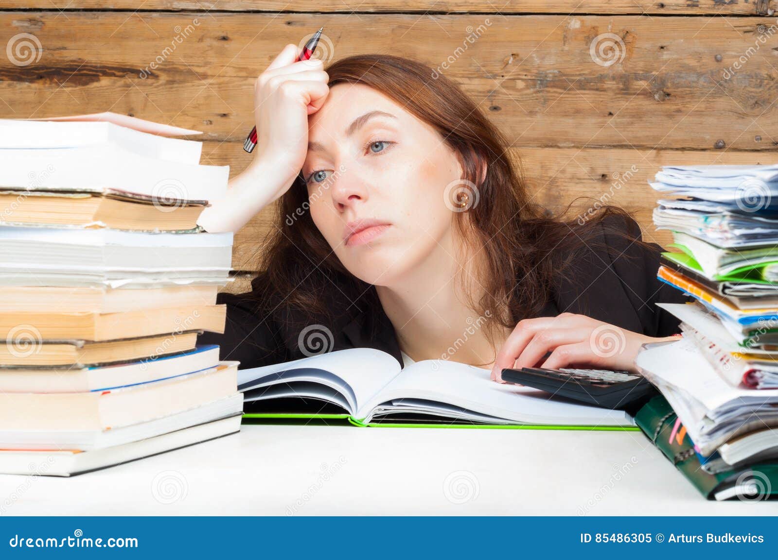 Woman Got Tired of Working and Studying Next To the Stack of Paper ...