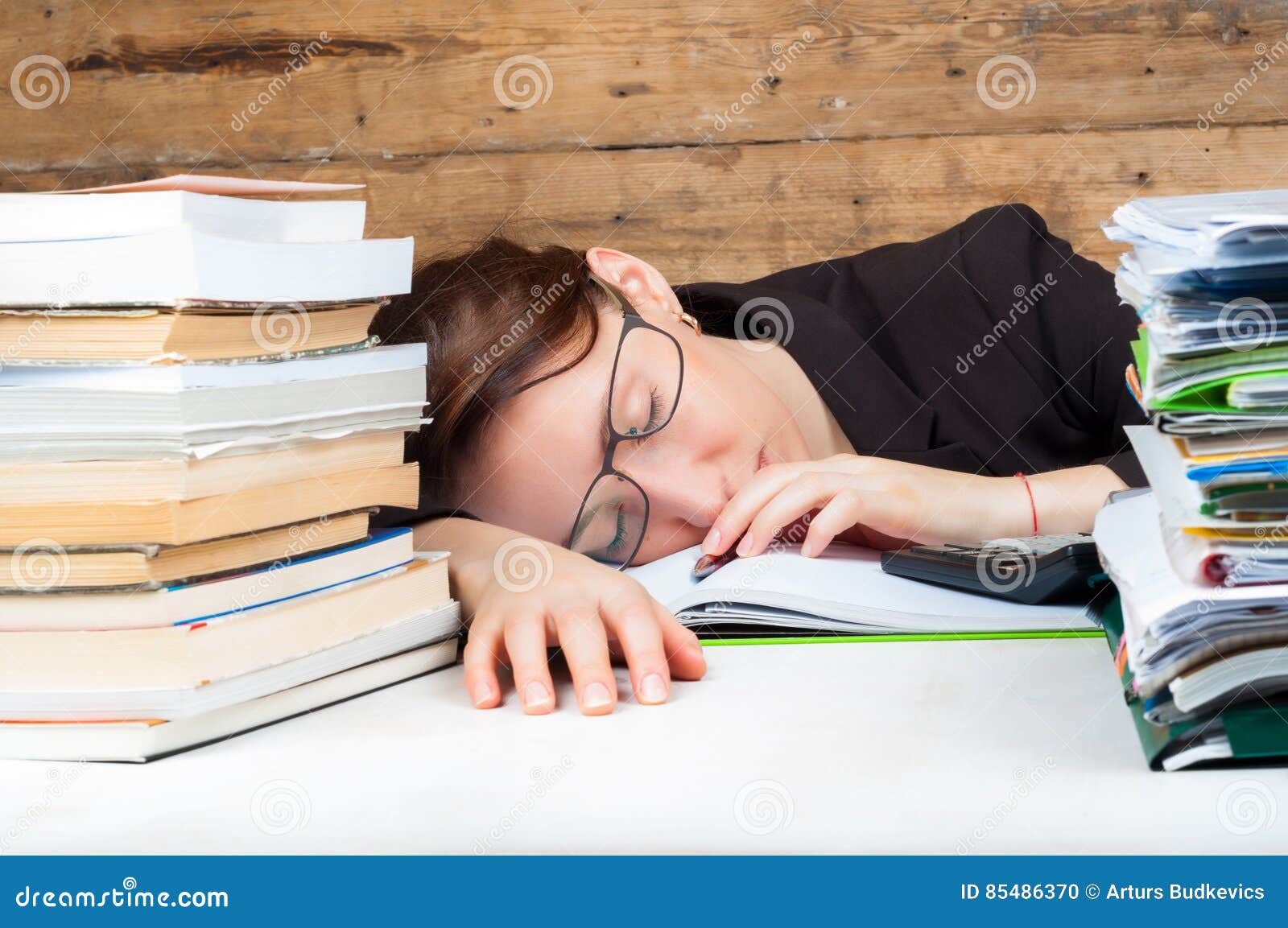 Woman Got Tired of Working and Studying Next To the Stack of Paper ...