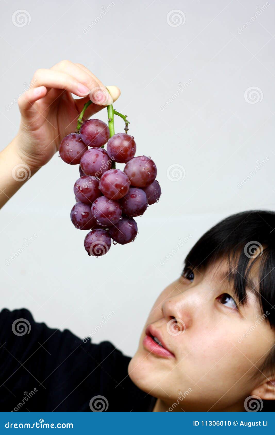 Woman with grapes stock photo. Image of eating, green - 11306010