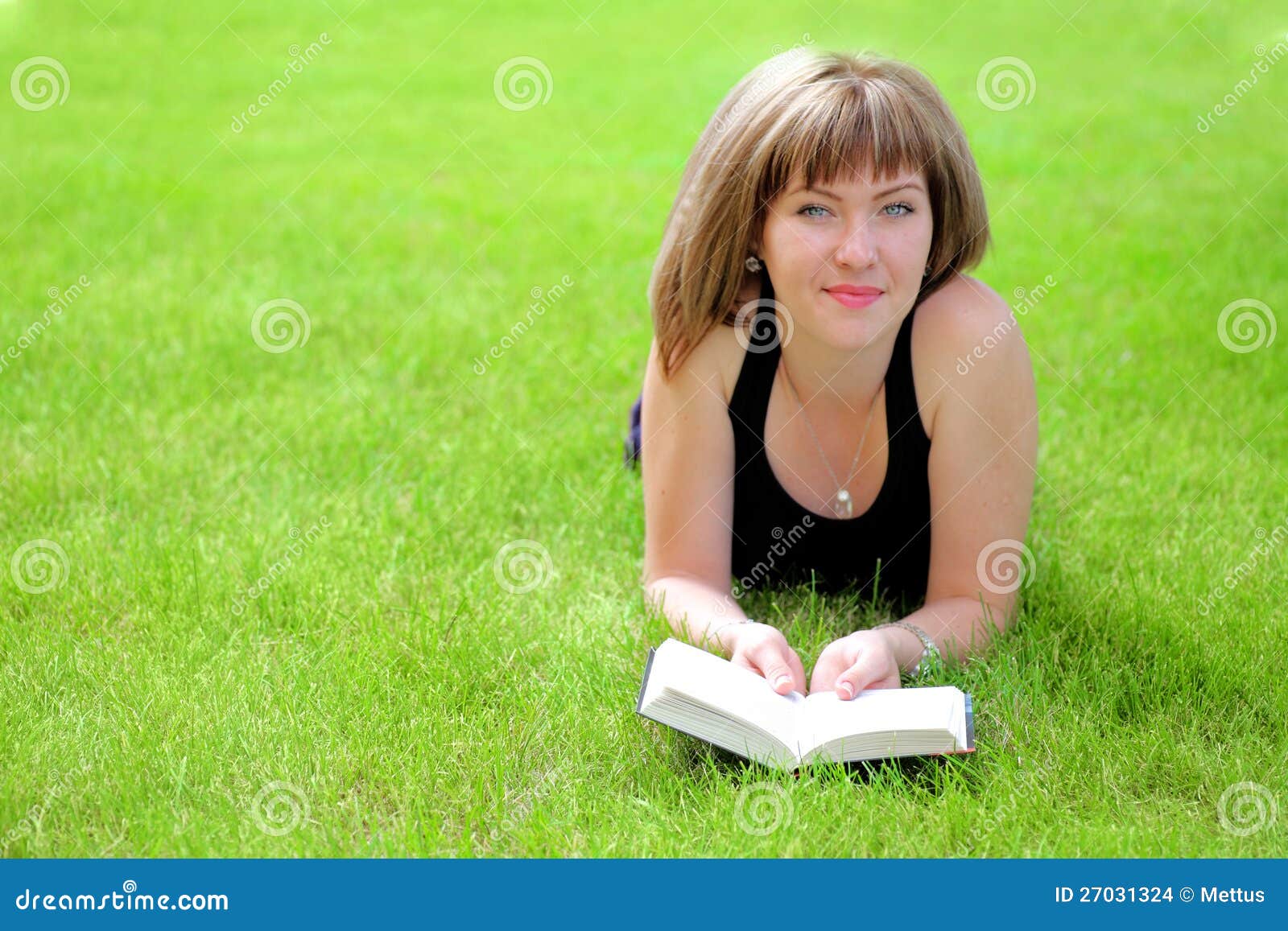 Woman on Grass Reading Book Stock Photo - Image of lawn, looking: 27031324