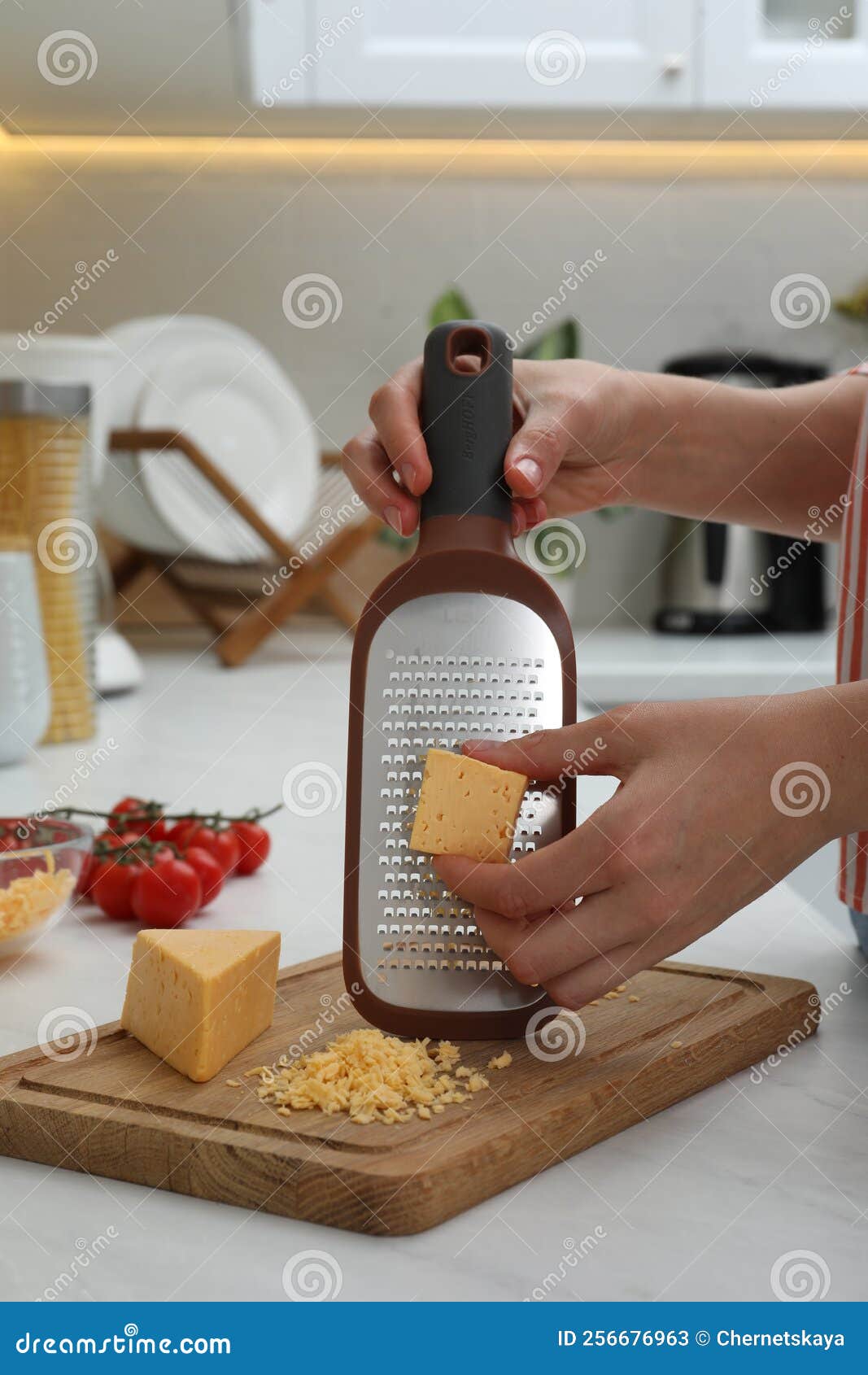 Woman Grating Cheese at Kitchen Counter, Closeup Stock Image - Image of ...